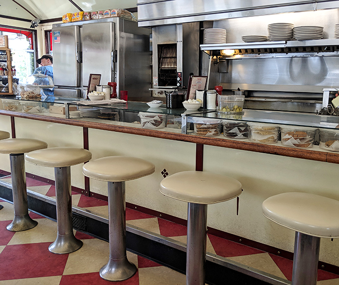 The stainless steel kitchen gleams with decades of service, where short-order magic happens before your eyes without any pretentious chef theatrics.
