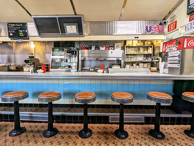 Counter seating where solo diners become instant friends and coffee cups never stay empty for long.