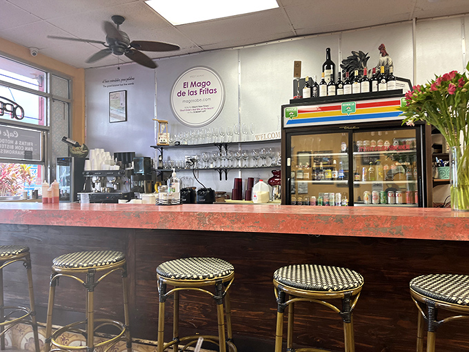 The bar seating offers front-row tickets to the culinary show, where every sizzle and flip becomes part of your dining soundtrack.