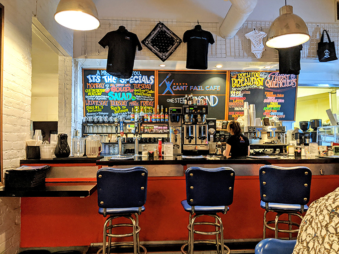 The counter seats offer front-row tickets to the culinary show, with colorful menu boards setting the stage for delicious decisions.