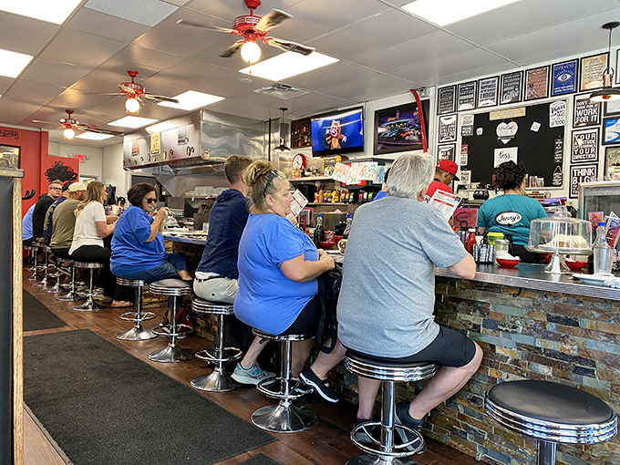 The counter seats fill with regulars who've earned their place in the diner's daily rhythm, like a Norman Rockwell painting come to life.