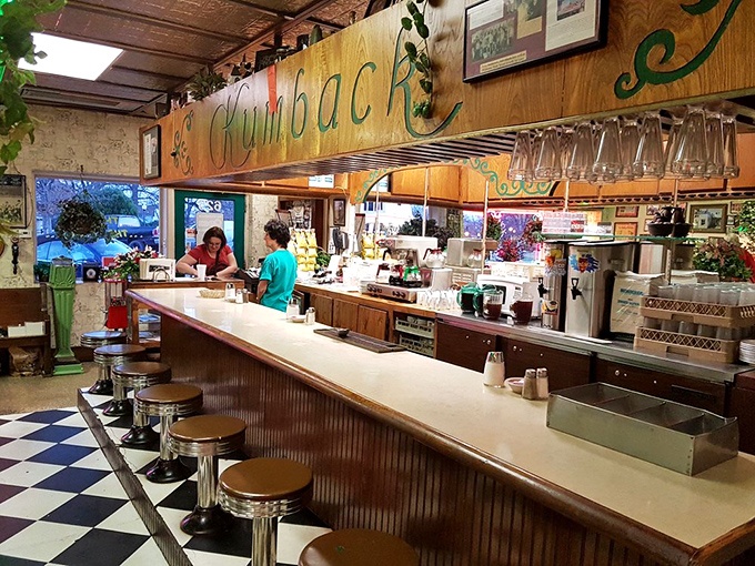 The lunch counter&mdash;where strangers become friends and regulars are treated like royalty. That wooden "Kumback" sign has witnessed decades of Oklahoma stories.