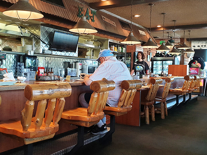 The counter seats—where solo diners become part of the restaurant's rhythm, watching the breakfast ballet unfold in real-time.