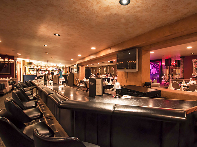 The bar: where solo diners find community, couples start date night, and everyone agrees that a pre-dinner Manhattan was an excellent decision.