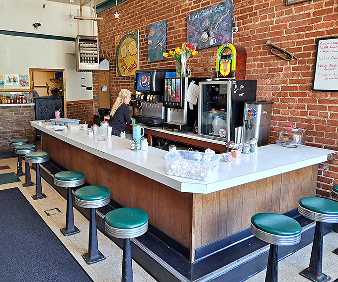 Classic diner counter seating&mdash;where solo diners become regulars and the coffee's always within arm's reach.