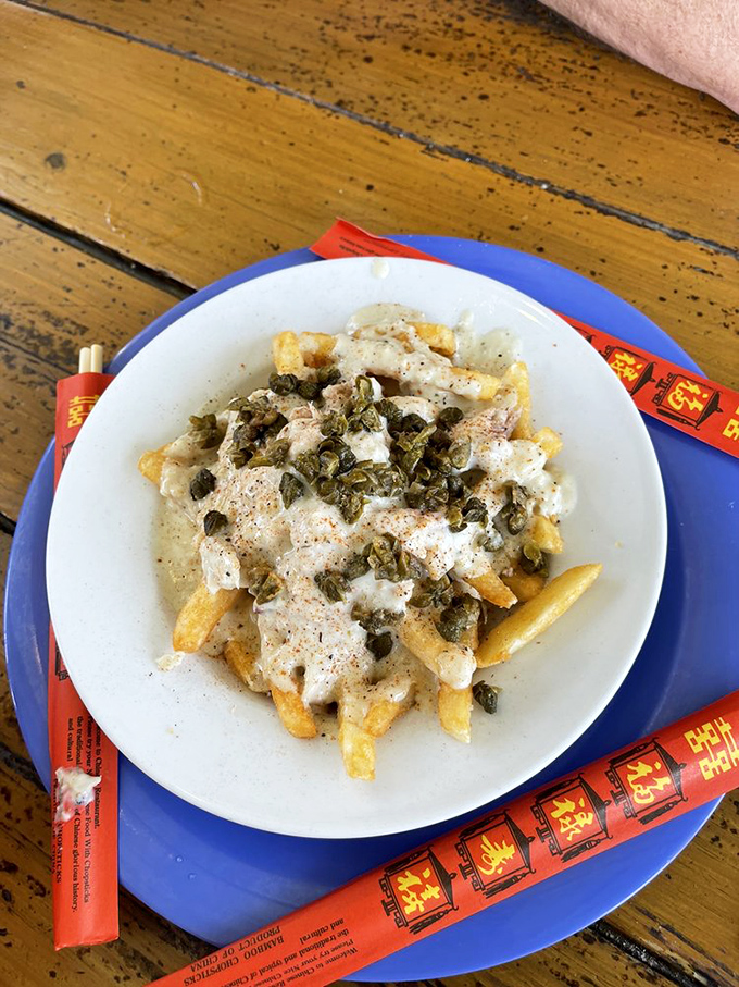 Crabby fries &ndash; where French fries meet creamy crab sauce and capers in a combination that should be illegal but thankfully isn't.