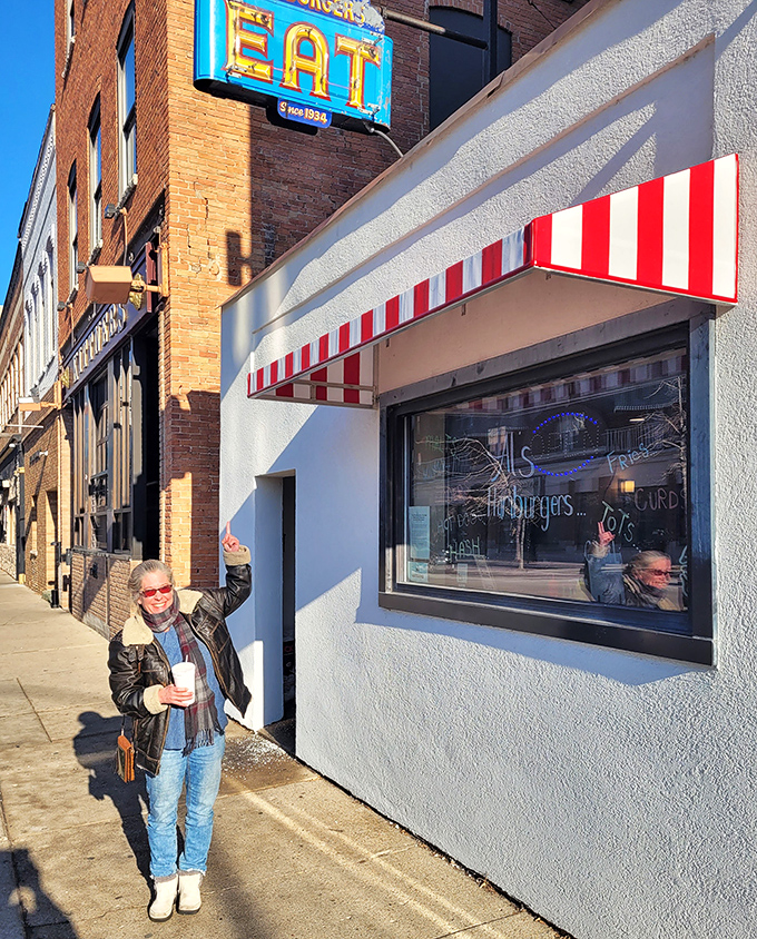 Outside Al's with a shake in hand—the universal pose of someone who just made an excellent life decision.