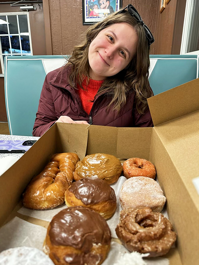 The universal expression of donut joy &ndash; that moment when you open the box and realize all your life choices have led to this perfect moment.