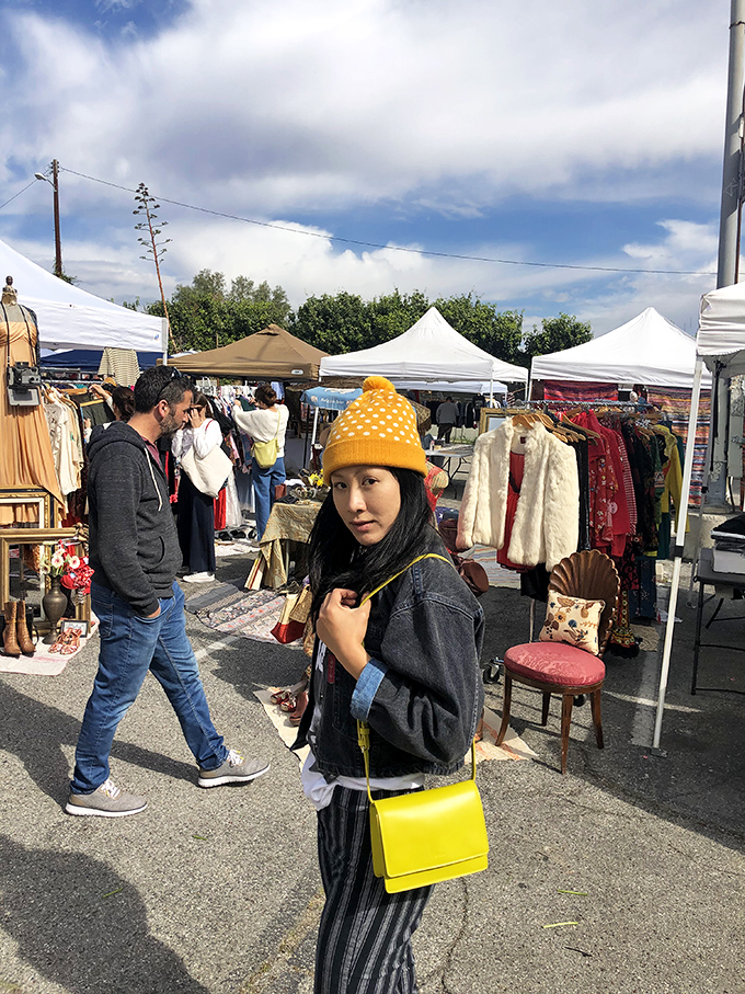 Beneath cloudy skies, treasure hunters navigate the market's maze, each wearing that focused expression that says, "I'm on a mission."