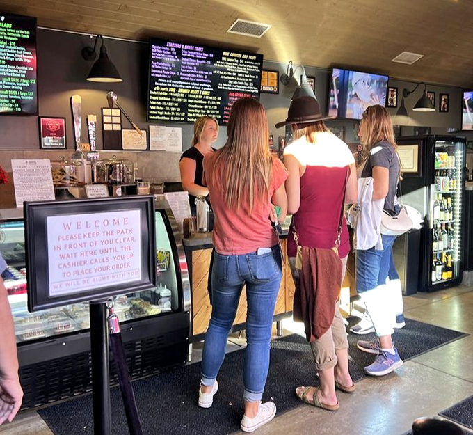 The line moves fast but anticipation builds, as hungry souls queue for their turn at barbecue paradise perfection.