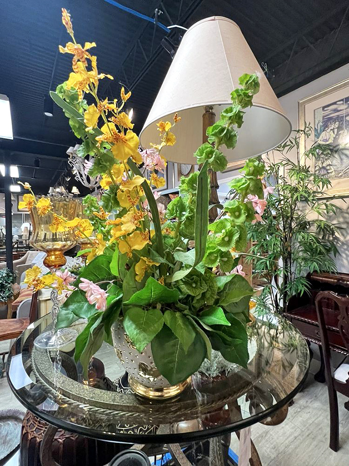 This artful arrangement of lamp and faux flowers could transform your coffee table from "where's the remote?" to "when did you hire a decorator?"