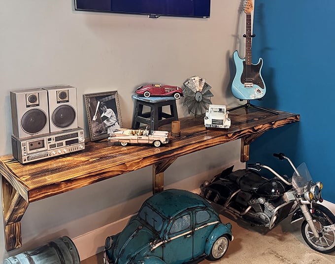 Vintage collectibles and nostalgic touches create a mini-museum of Americana. Every shelf tells a story while you wait for your steak to arrive.