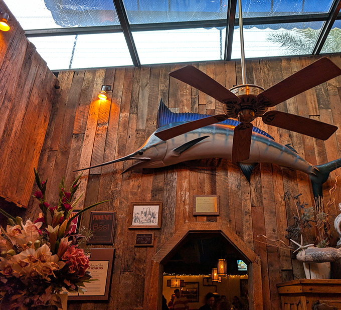 That marlin mounted proudly overhead watches diners enjoy ocean bounty in true Arizona desert style.