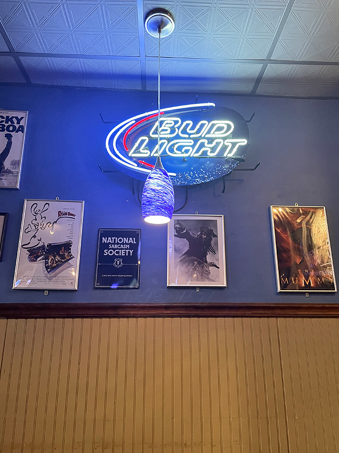 Movie posters and neon signs create that perfect backdrop for conversations that flow as easily as the drinks from behind the bar.