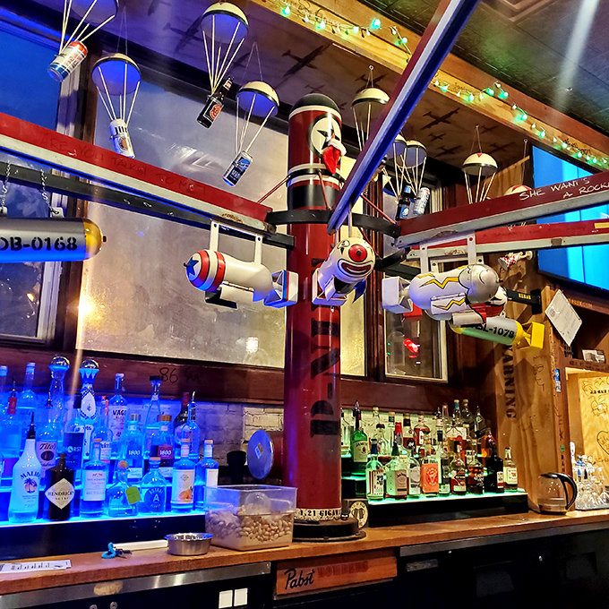 The bar area looks like what would happen if a WWII aviation museum and a craft beer enthusiast had a very creative child.