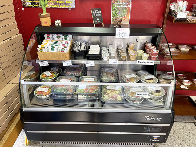 The deli case &ndash; where decisions get harder and willpower goes to die. Each container holds a different delicious destiny.