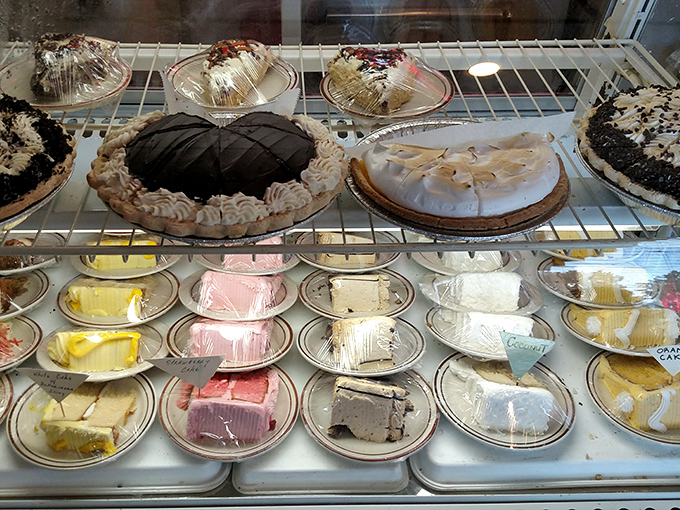 The dessert case&mdash;a glass-fronted museum of American sweet tooth archaeology. Each pie and cake tells a story of tradition and indulgence.