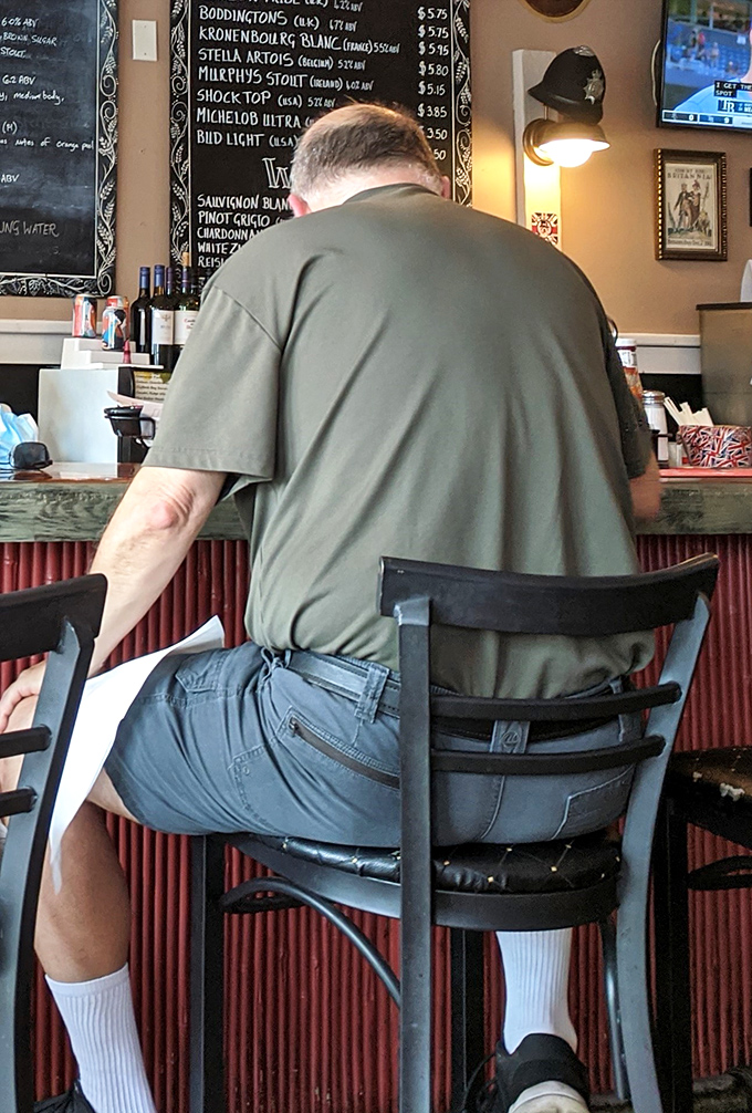 Where locals gather to debate cricket scores and football matches while enjoying a taste of Britain in the Sunshine State.