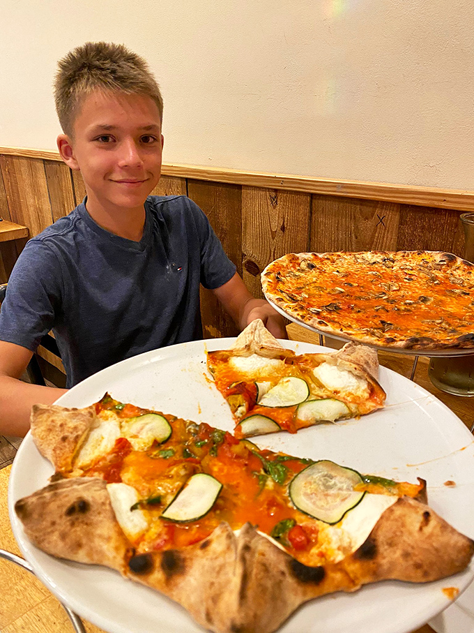 That look of pizza anticipation is universal&mdash;whether you're eight or eighty, there's nothing like the moment before that first perfect bite.