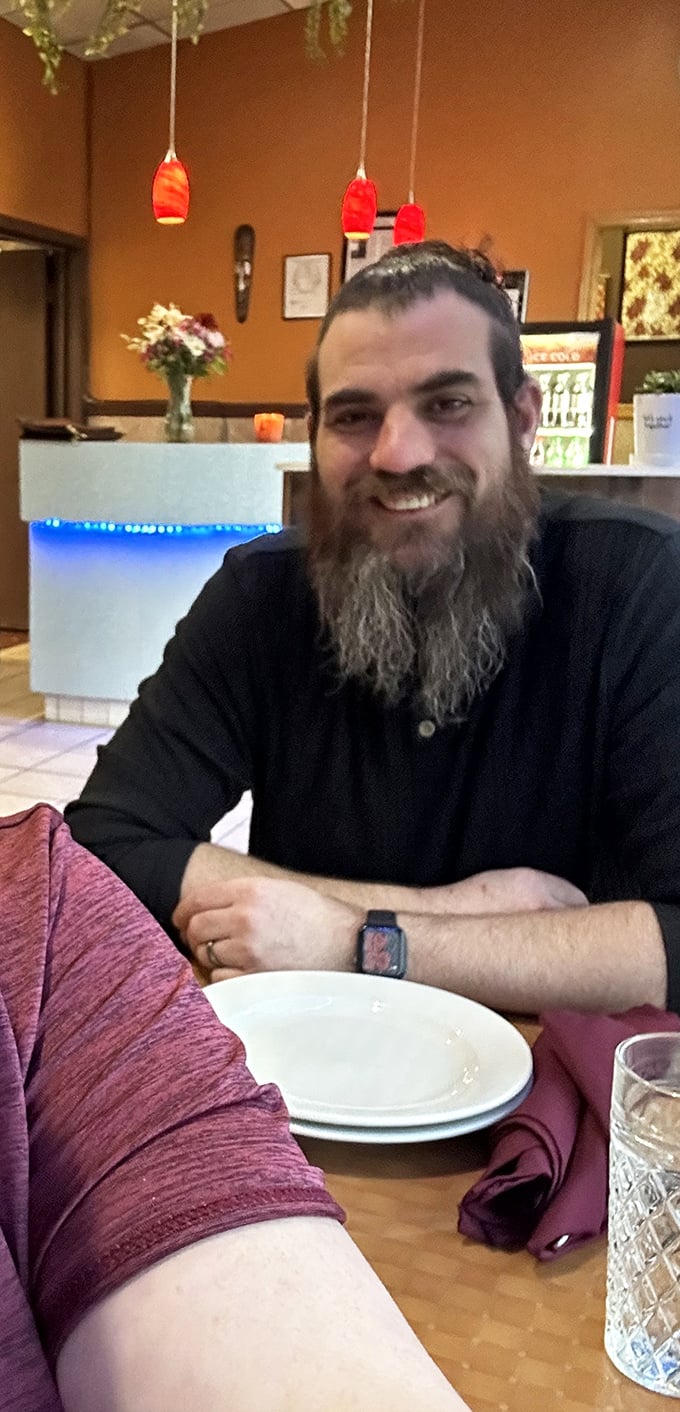 A happy diner enjoying the moment &ndash; the universal expression of someone who's just discovered their new favorite restaurant.