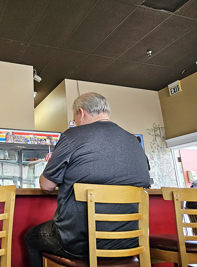 A patron enjoying the solitude of counter dining. Sometimes the best breakfast conversation is the one you have with your food.