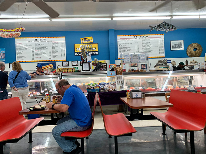 The universal deli pose: hunched over plates, completely absorbed in the serious business of eating well.