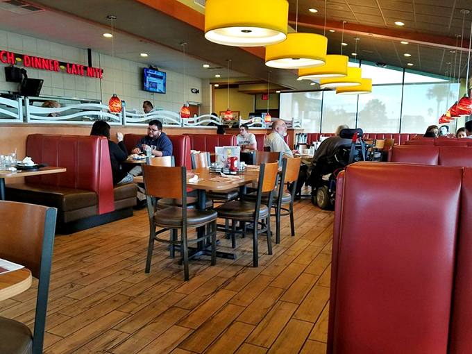 Where strangers become temporary neighbors, united by the universal morning ritual of coffee refills and deciding between sweet or savory.