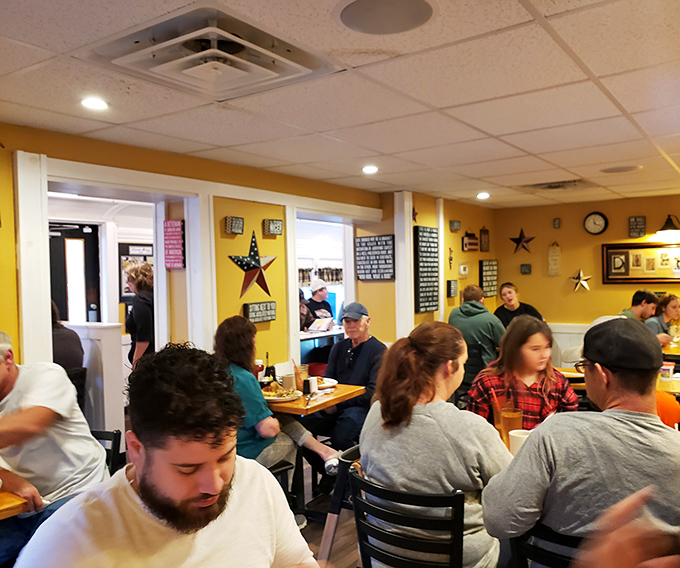 A bustling dining room where locals gather not just for food, but for the community that happens between bites.