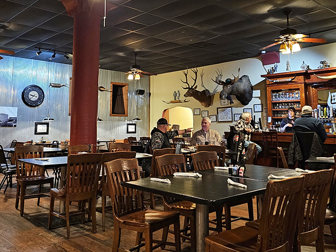 Where locals and visitors alike gather to debate the merits of medium-rare versus medium while surrounded by hunting trophies that have seen it all. 