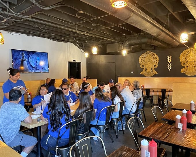 A gathering of the wise&mdash;people who know where to find LA's best BBQ. The Filipino artwork watching over diners like benevolent culinary guardians.