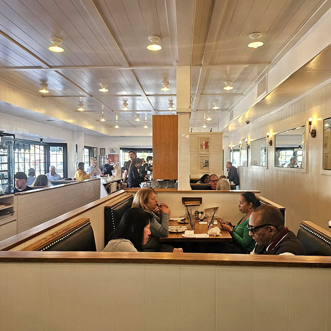 The dining room hums with the universal language of satisfaction &ndash; forks meeting plates and conversations punctuated by appreciative nods.