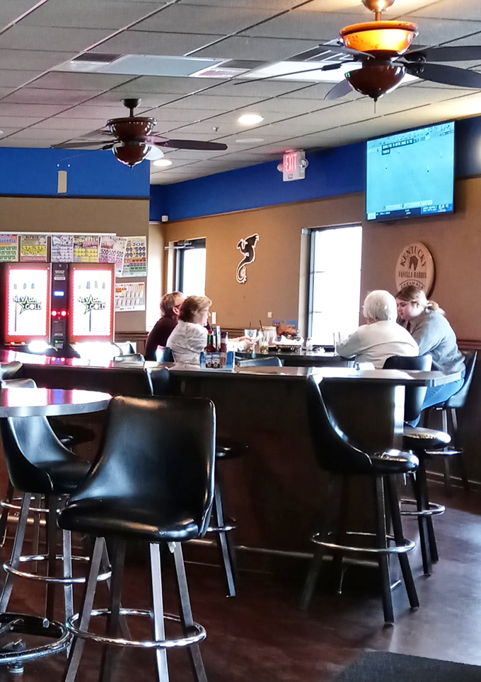 Where regulars gather at the bar, solving world problems one pint at a time. The ceiling fans spin stories of countless game days and celebrations.
