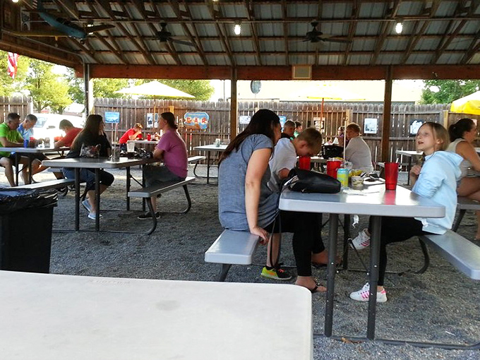 When strangers become temporary family under the shared roof of BBQ appreciation. The universal language of "pass the sauce" needs no translation.