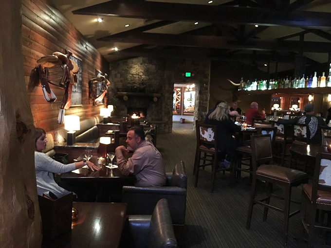 The dining room buzzes with the energy of people having exactly the kind of evening they hoped for. Wood paneling and stone create the perfect backdrop for memorable meals.