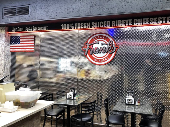 Simple, unpretentious dining where the metal backdrop reminds you this is serious food business, not some fancy small-plate establishment.