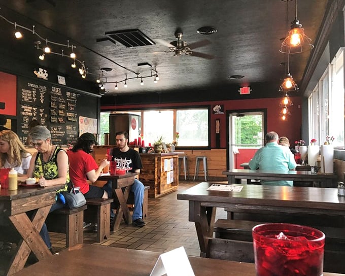 Where barbecue magic happens&mdash;simple tables, red walls, and the collective anticipation of everyone waiting for their name to be called.