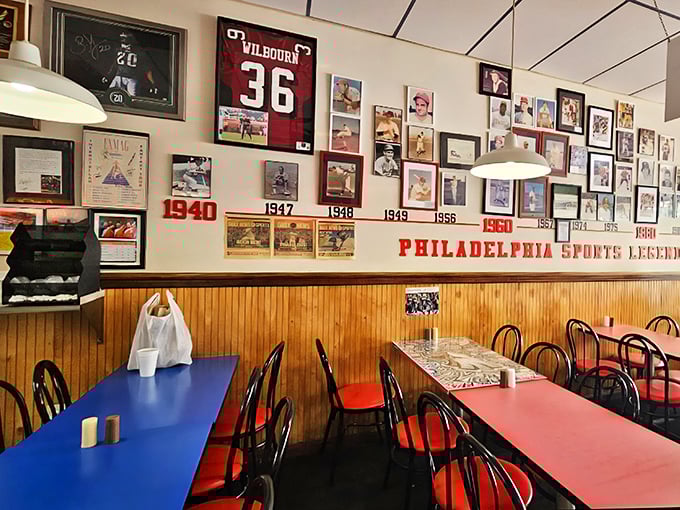 The wall of Philadelphia sports legends watches over diners like sandwich guardian angels. History and hoagies under one roof.