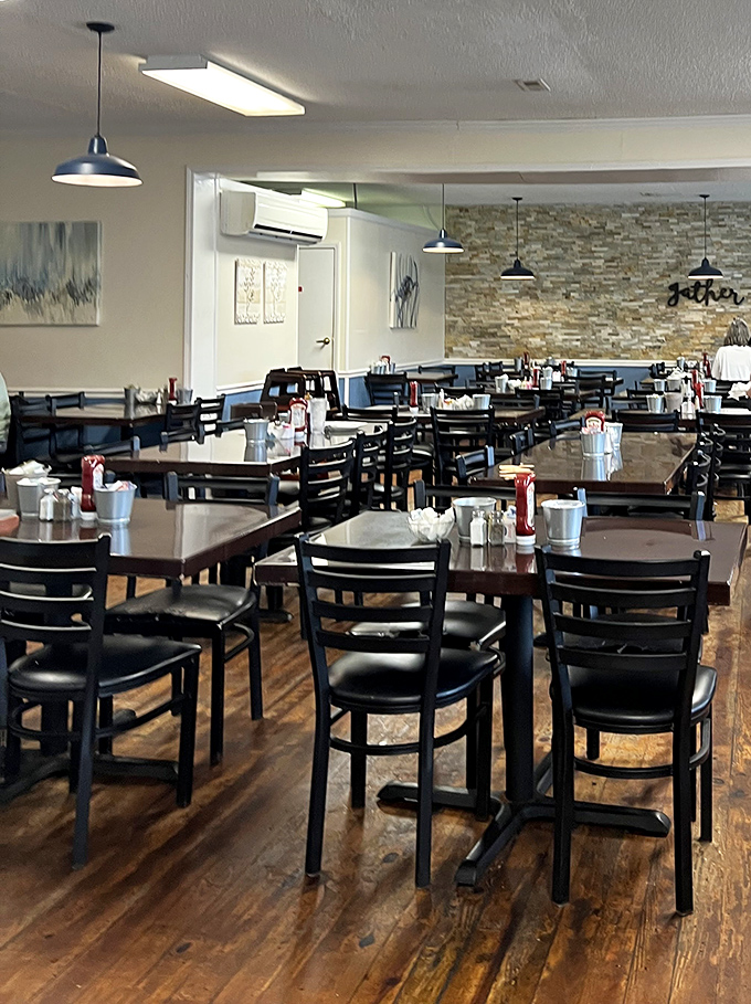 A dining room designed for lingering conversations and second cups of coffee, where wooden floors tell stories of countless satisfied customers.