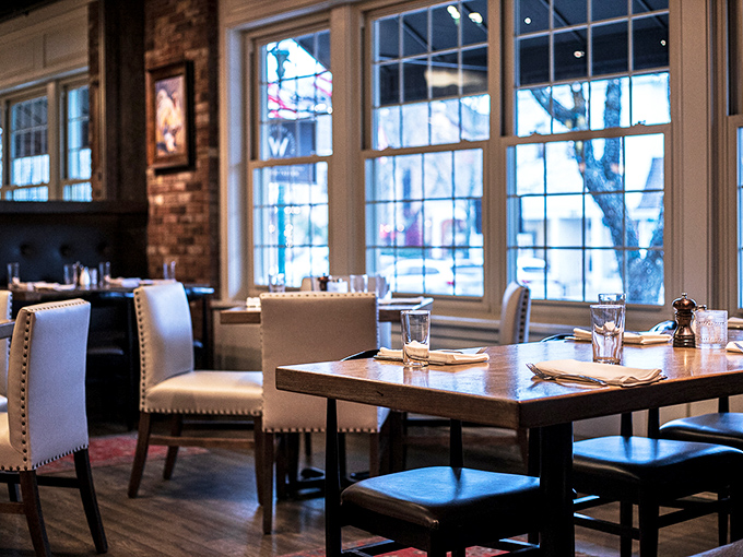 Natural light floods through tall windows, turning ordinary tables into stages where everyday dining becomes something worth remembering.