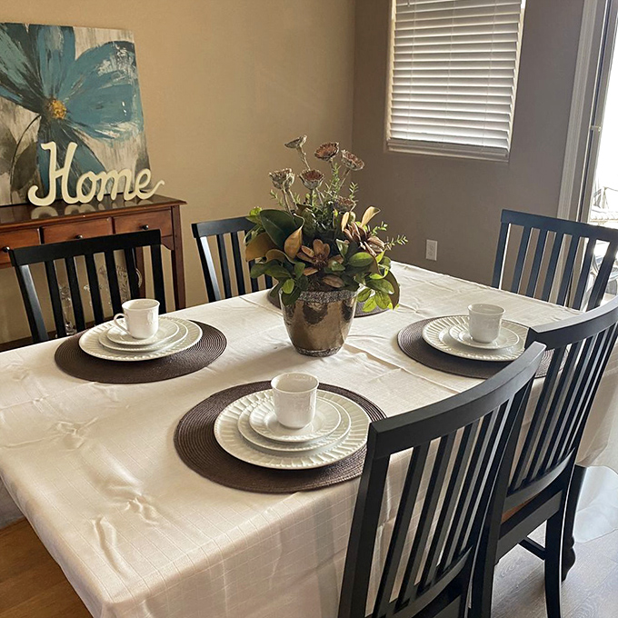 The "after" photo of thrift store magic. That dining set probably cost less than your last dinner out and looks twice as good.