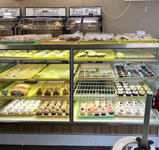 The bakery case &ndash; or as I call it, "The Museum of Delicious Art." Each tray holds edible masterpieces more satisfying than anything in the Louvre.