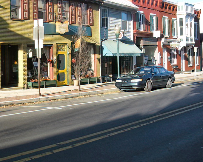Vibrant storefronts in varying colors create a downtown that's both Instagram-worthy and actually affordable to live near.