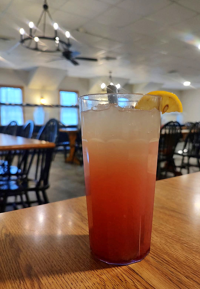 A tall glass of something sweet and pink&mdash;proof that sometimes the best dining companions don't say a word.