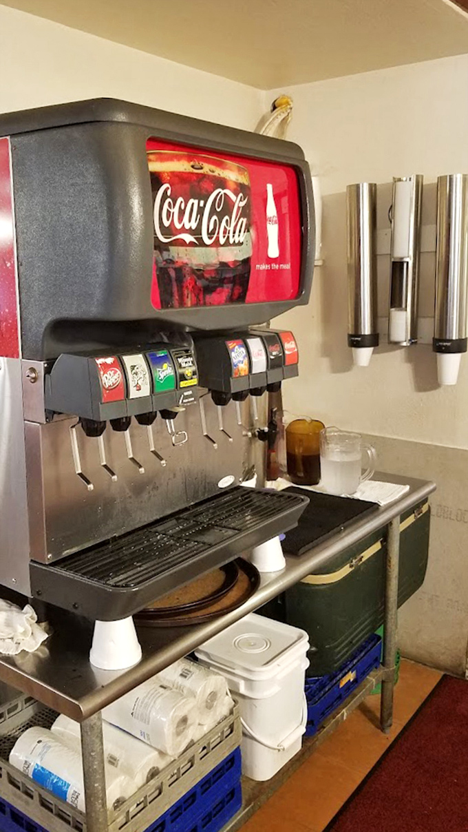 The soda fountain stands ready to dispense liquid happiness, a nostalgic counterpoint to craft cocktails and artisanal beverages.