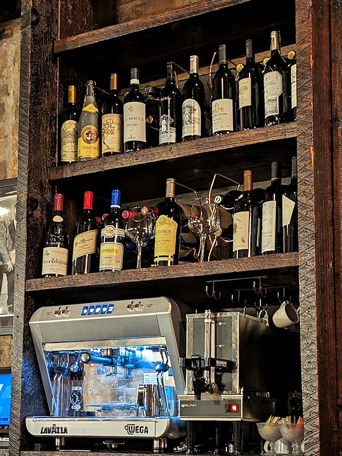 The bar's impressive wine collection stands ready for duty, proving that proper steak pairing is serious business at Geraldine's.