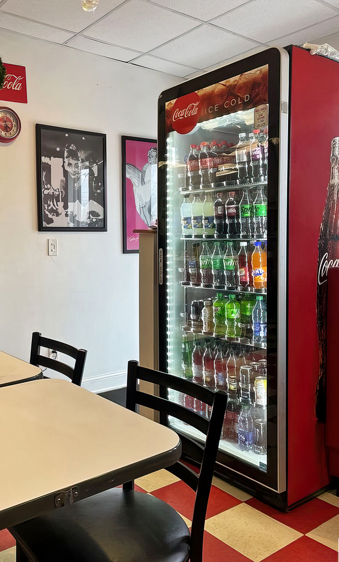 The beverage cooler stands like a colorful sentinel of refreshment. In diner language, this translates to "wash down that gyro properly."