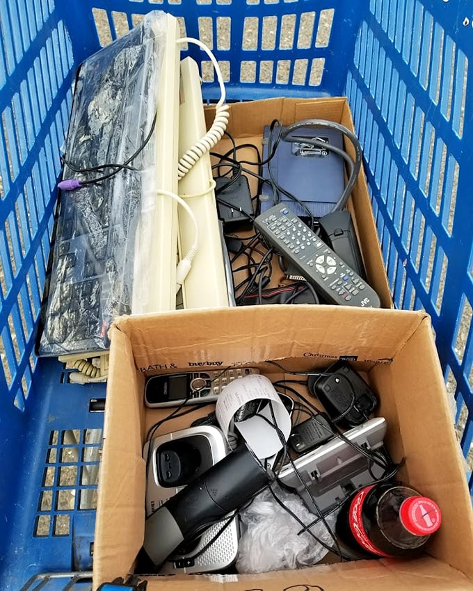 Technology time capsules nestled in blue plastic&mdash;yesterday's gadgets waiting for tomorrow's tinkerers and nostalgic collectors.