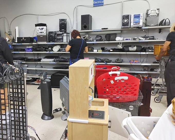 The electronics testing station—where brave employees determine if that 1990s stereo system still has some life left in its speakers.