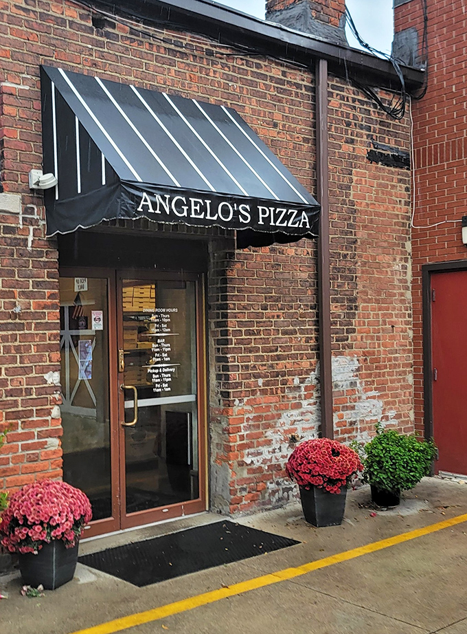 The entrance adorned with seasonal flowers says, "Yes, we care about details, which is exactly why our food will blow your mind."
