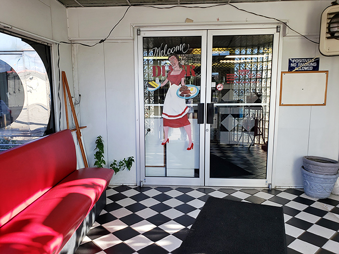 The entrance says it all &ndash; checkerboard floors, red vinyl bench, and a vintage waitress illustration welcoming you to a slice of Americana that's increasingly hard to find.